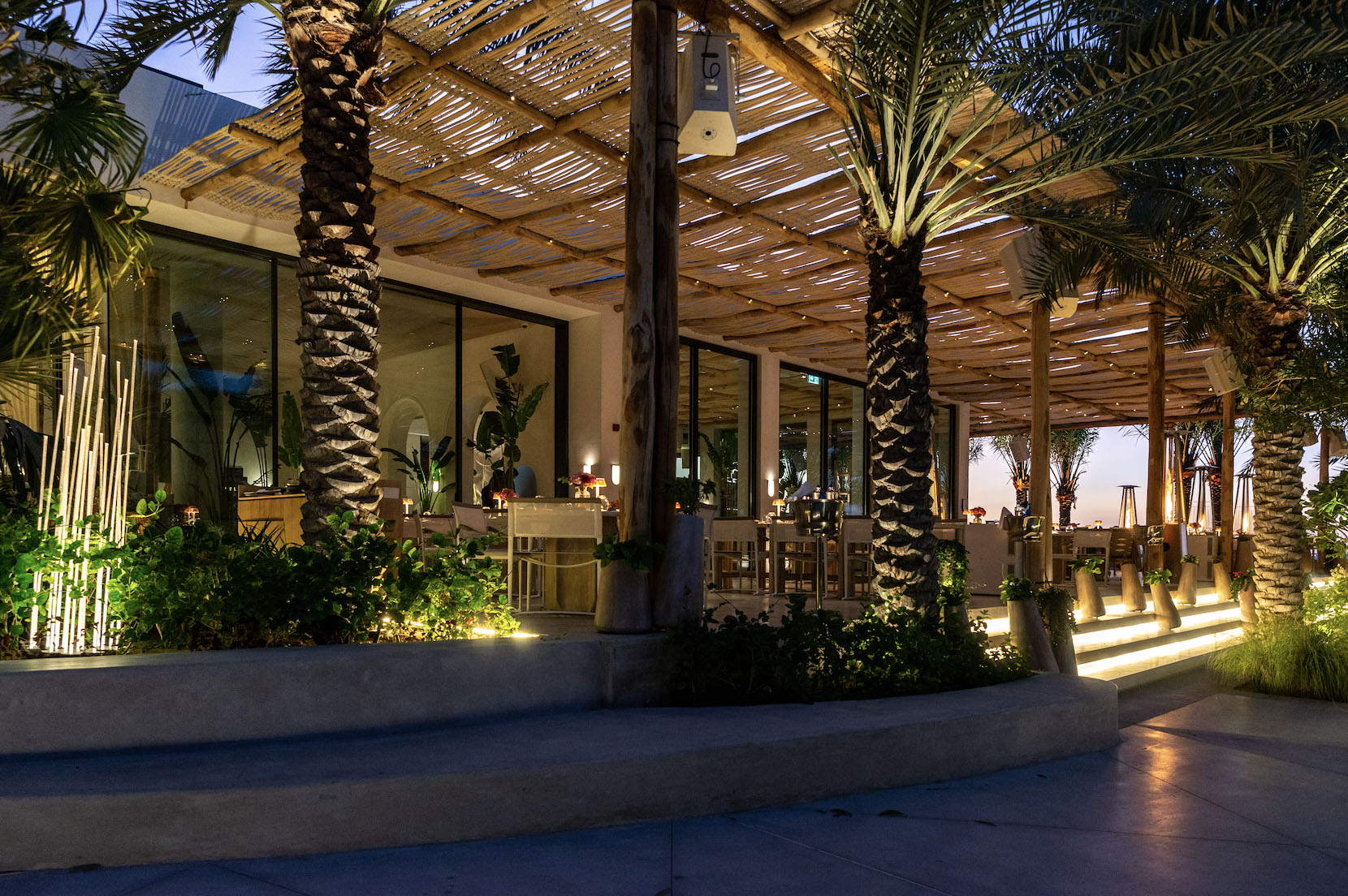 Robust and highly exclusive lighting at the upscale Nammos beach ...